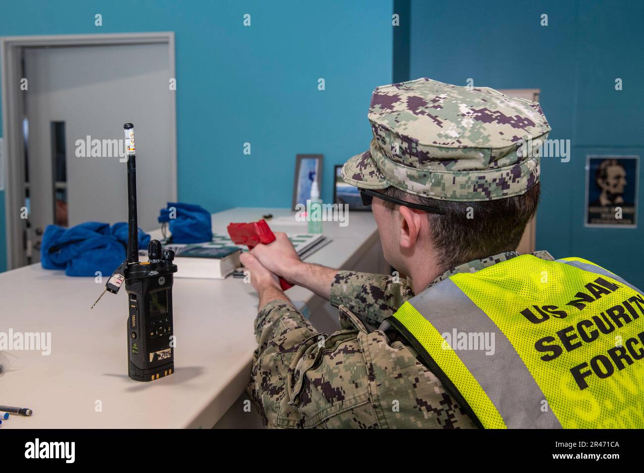 Master-at-Arms 3rd Class Spencer Samuel Squires responds to a simulated ...