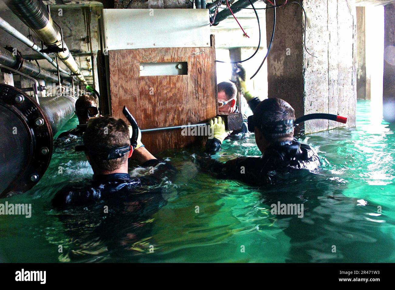 Underwater Construction Team 2 Sailors refurbish a pier 141114 Stock ...