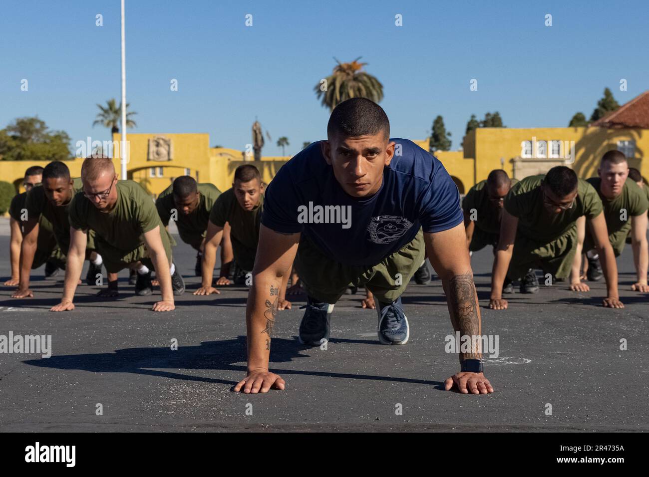 A U.S. Marine Corps drill instructor with India Company, 3rd Recruit Training Battalion, leads ...