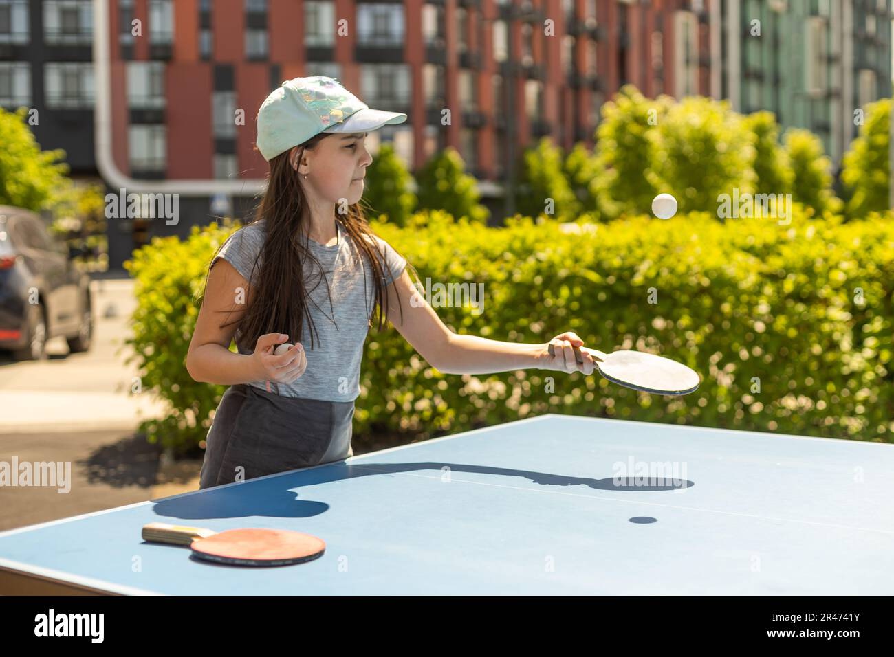 Cute girl playing table tennis hi-res stock photography and images - Alamy