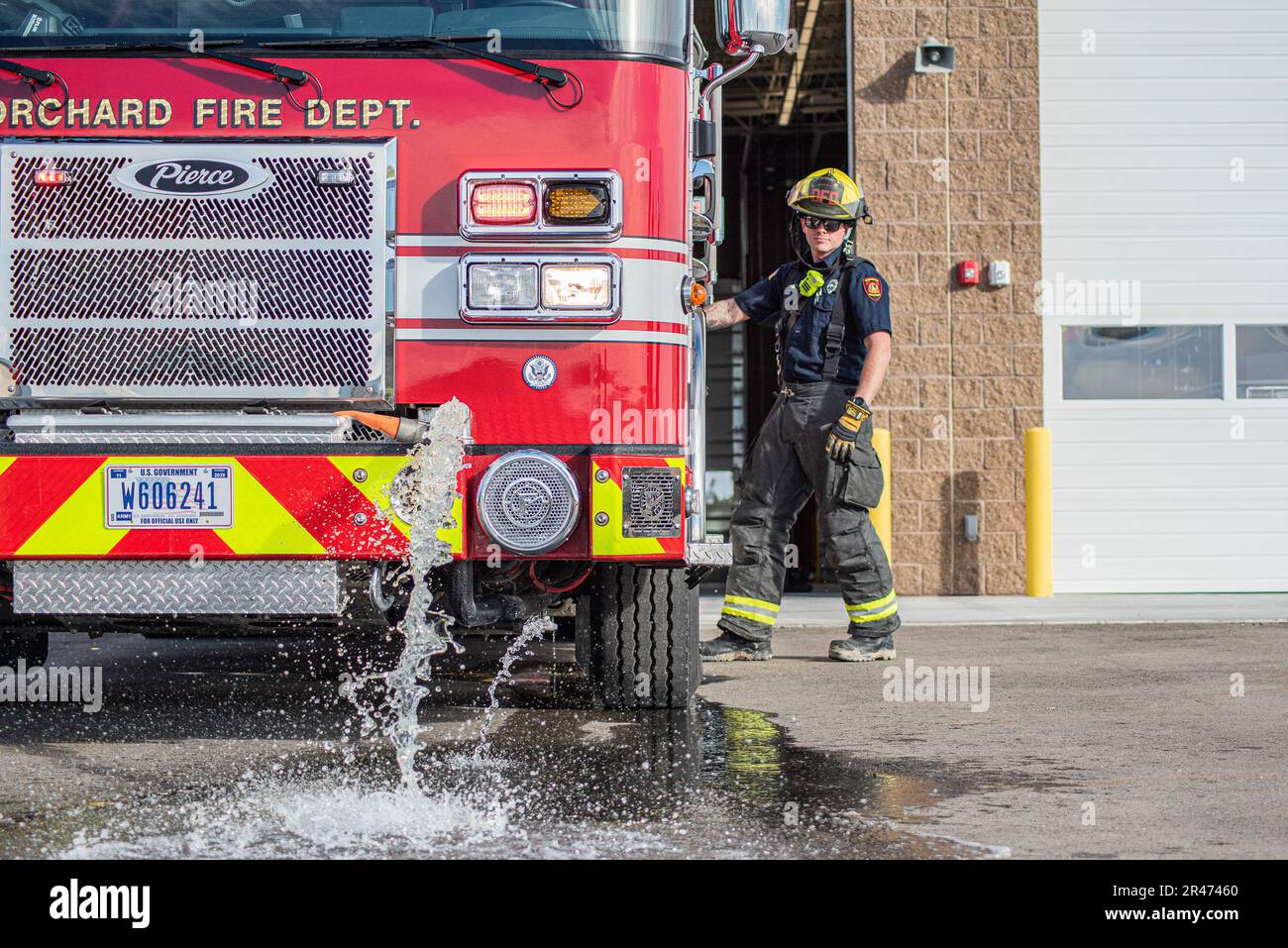 Firefighter Matt Conklin conducts routine maintenance on a fire engine ...