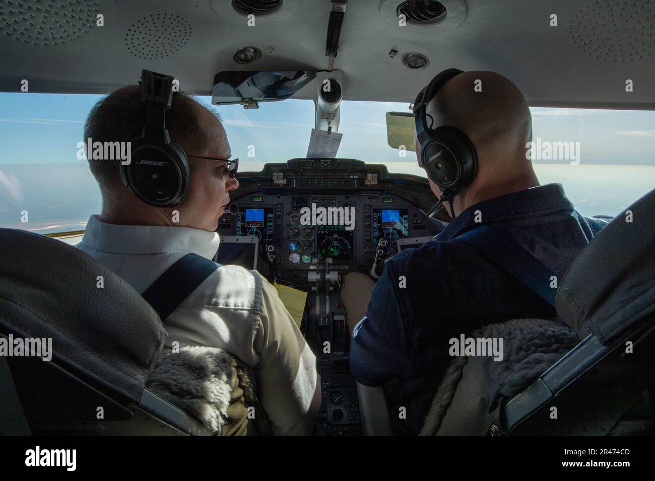 Maj. Kirk Schlueter, 76th Airlift Squadron aircraft commander, left, and Maj. Tyler Neidecker ...