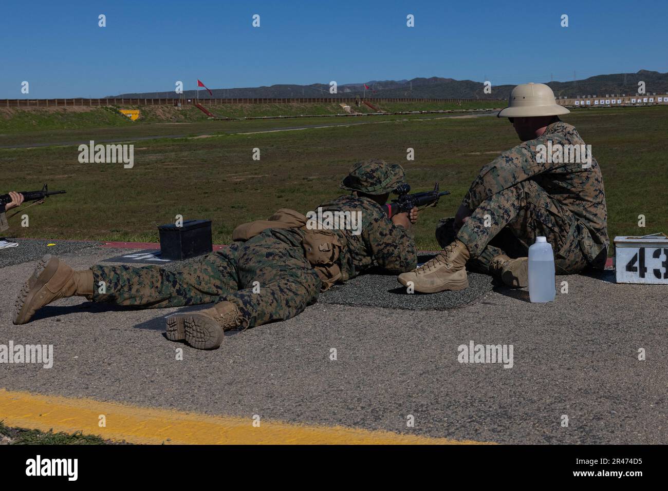 A U.S. Marine Corps range coach with Edson Range, Weapons and Field ...