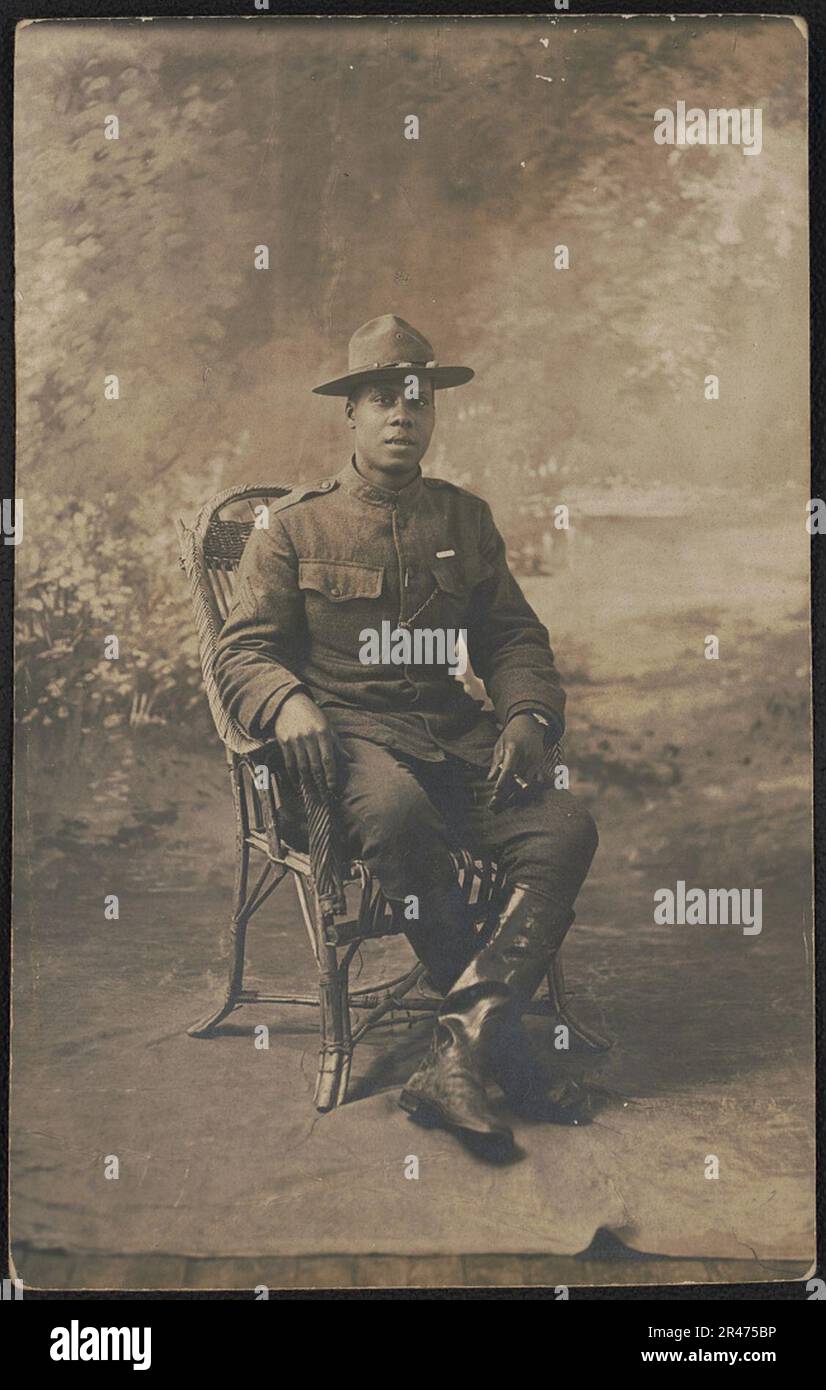 Unidentified African American soldier in uniform with marksmanship ...