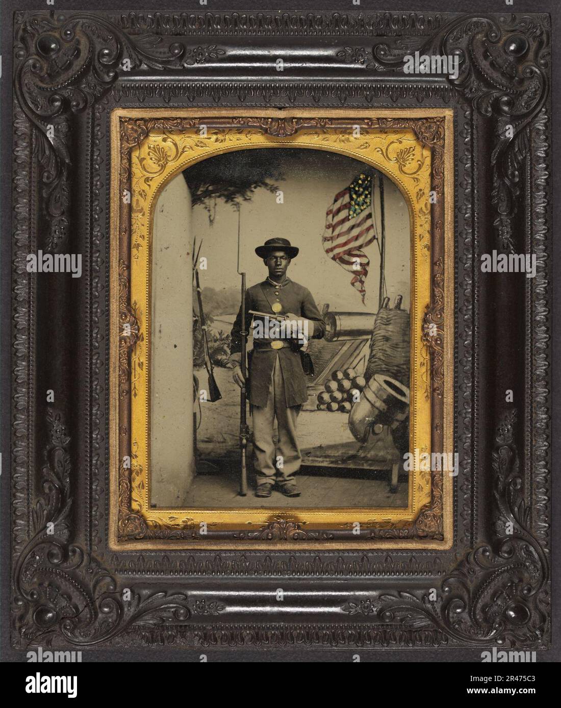 Unidentified African American soldier in Union uniform with a rifle and ...