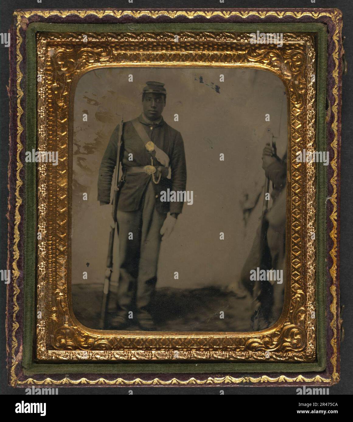 Unidentified African American soldier in Union uniform and gloves with ...