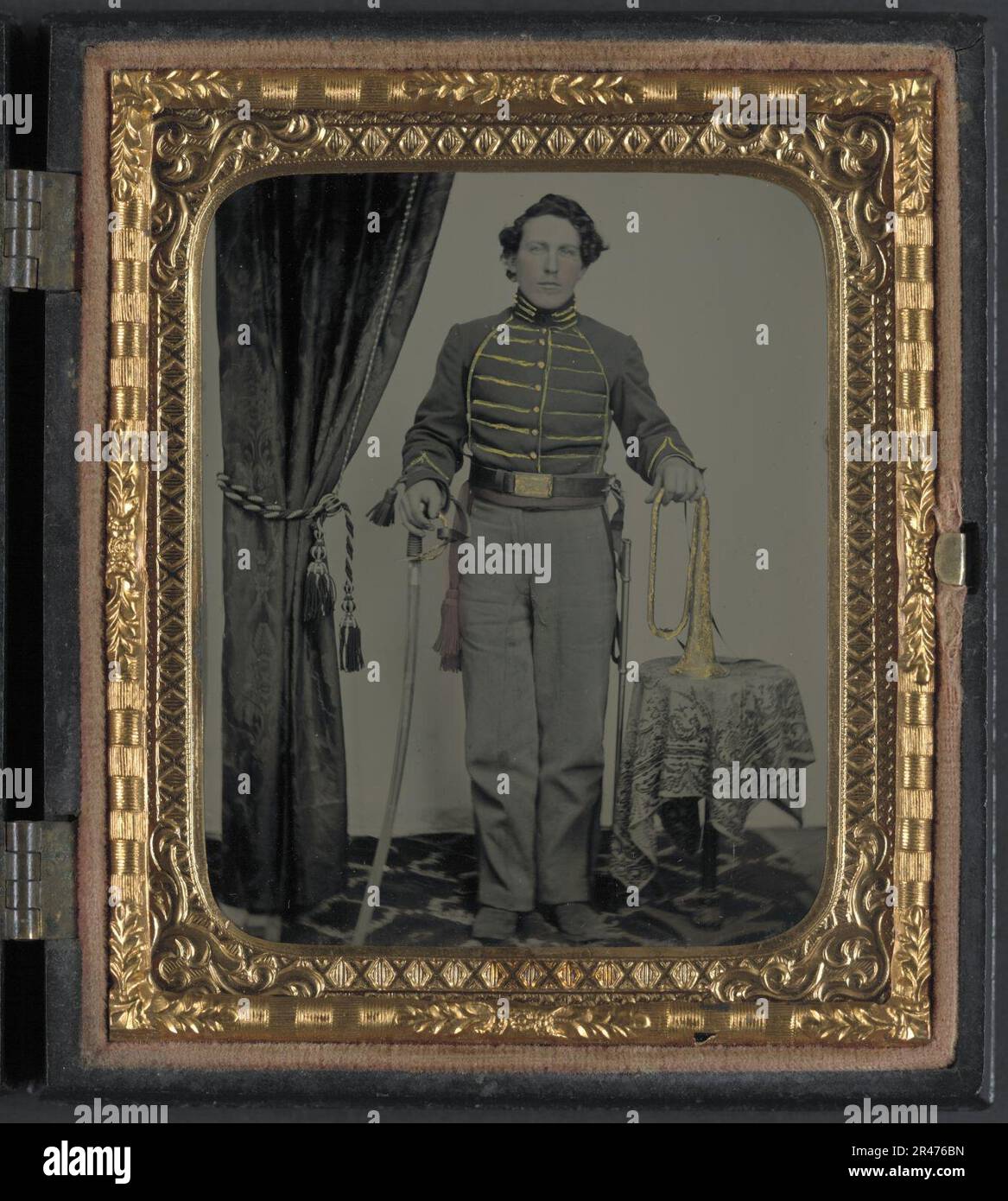 Unidentified cavalry soldier in Union uniform with bugle and sword ...