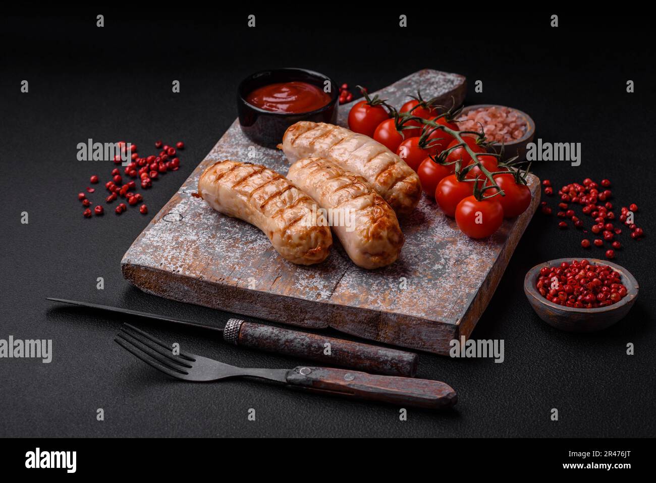 Delicious grilled sausages from chicken or pork meat with salt, spices ...