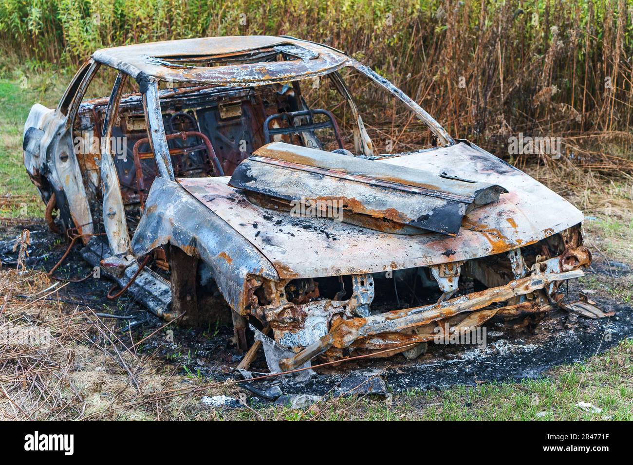 A burnt-out car. Car old burned by fire. Fire burned car Stock Photo ...