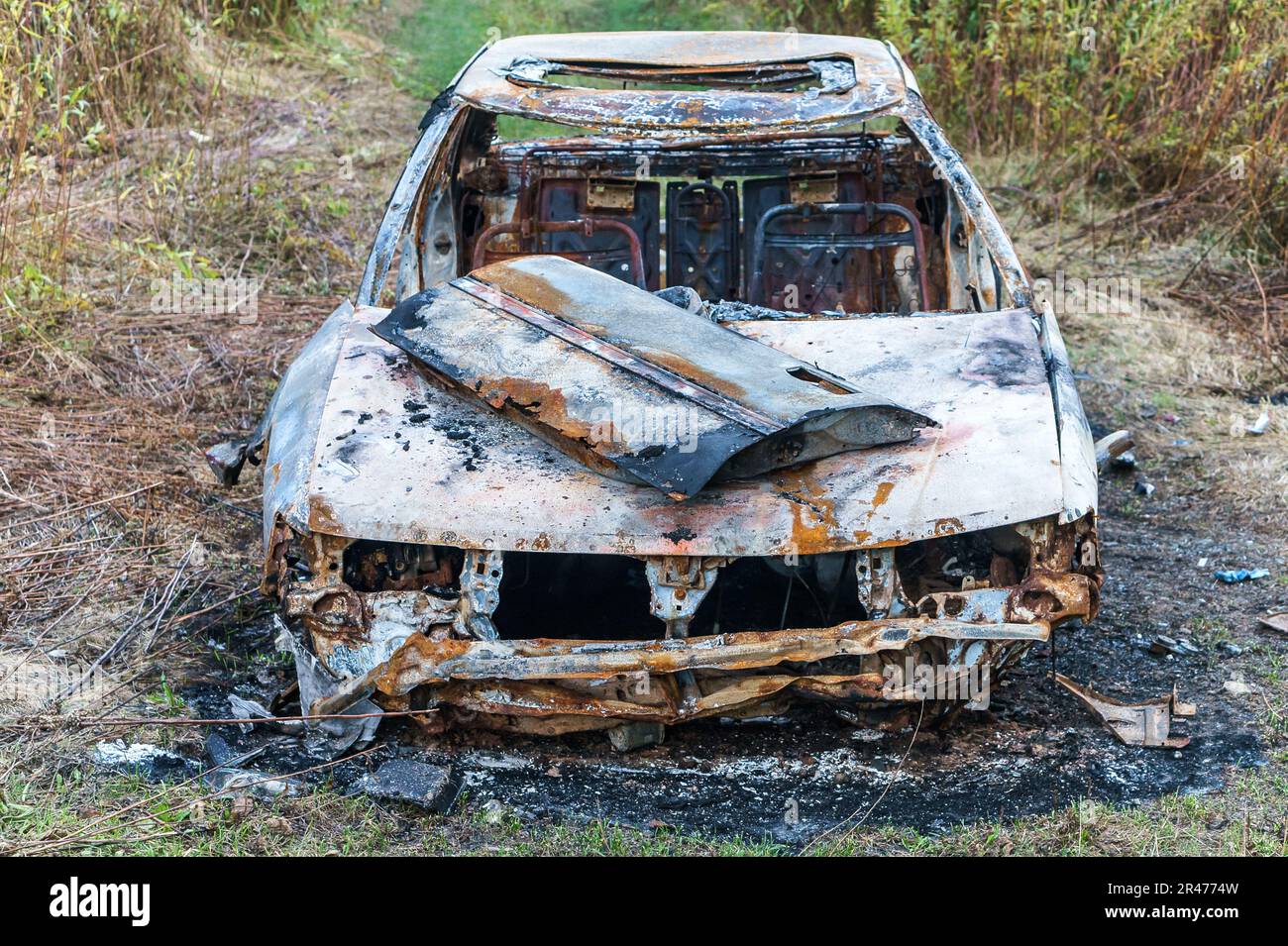 A burnt-out car. Car old burned by fire. Fire burned car Stock Photo ...