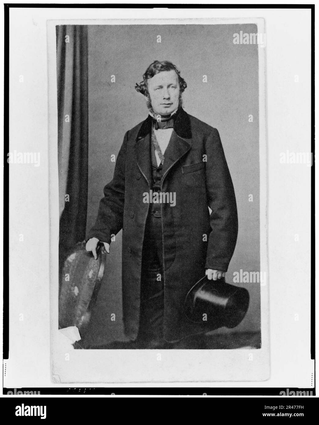 Unidentified man, three-quarter length portrait, standing, posed ...