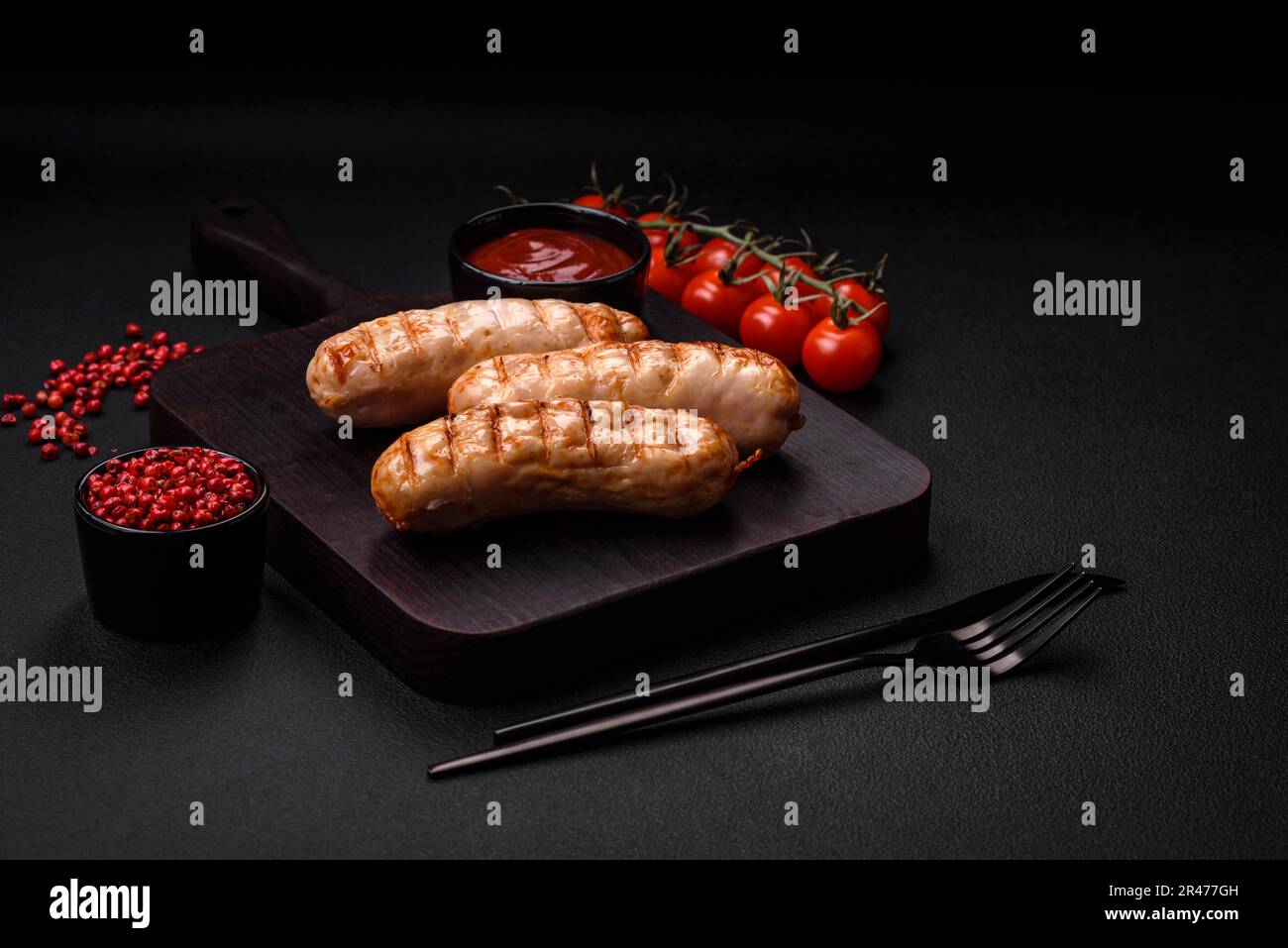 Delicious grilled sausages from chicken or pork meat with salt, spices ...