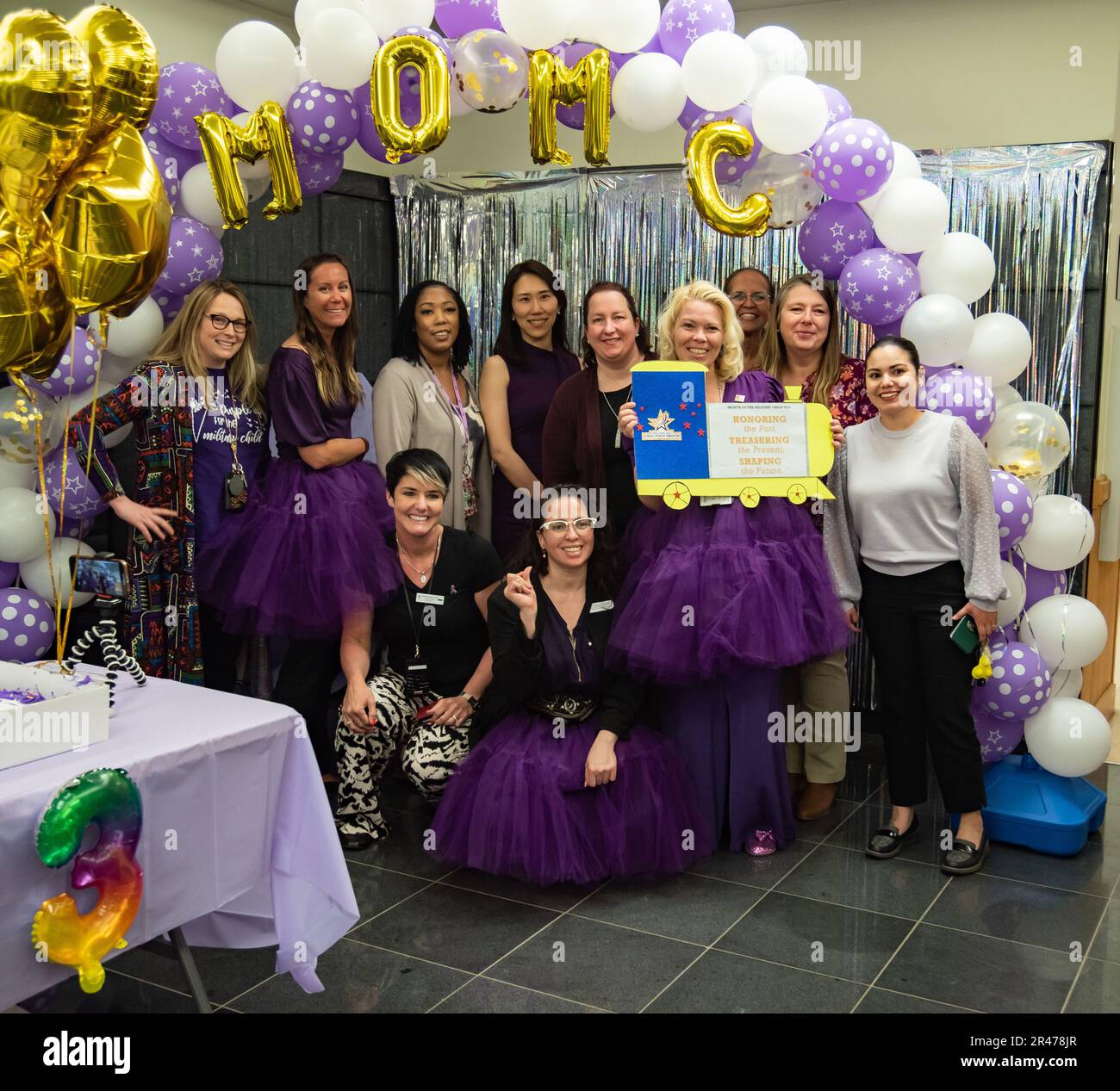 Members of the U.S. Army Garrison community pose for a photo during the ...