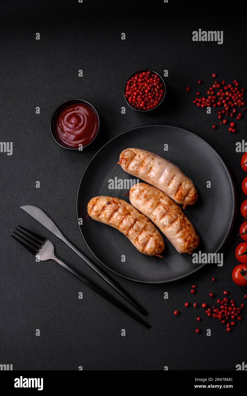 Delicious grilled sausages from chicken or pork meat with salt, spices ...