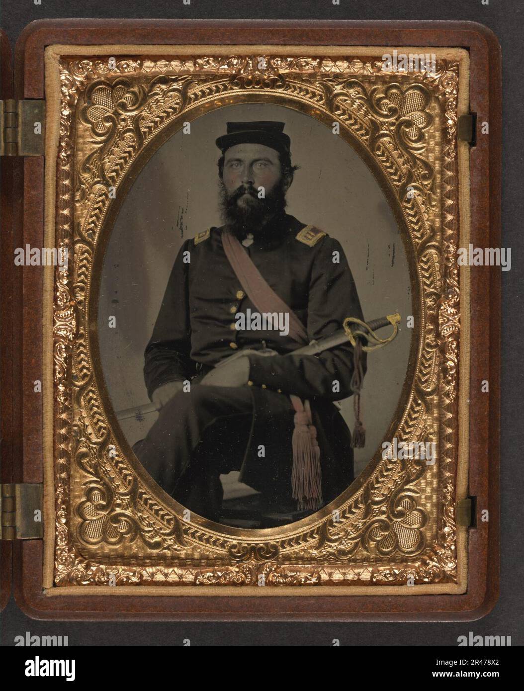 Unidentified soldier in Union Captain uniform with crimson sash holding ...