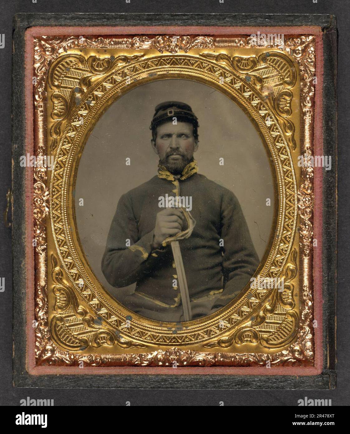 Unidentified soldier in Union cavalry uniform holding cavalry saber ...