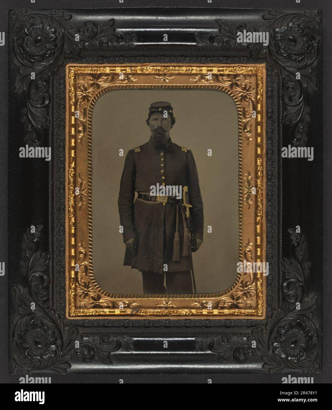 Unidentified soldier in Union captain's frock coat and officer's sash ...