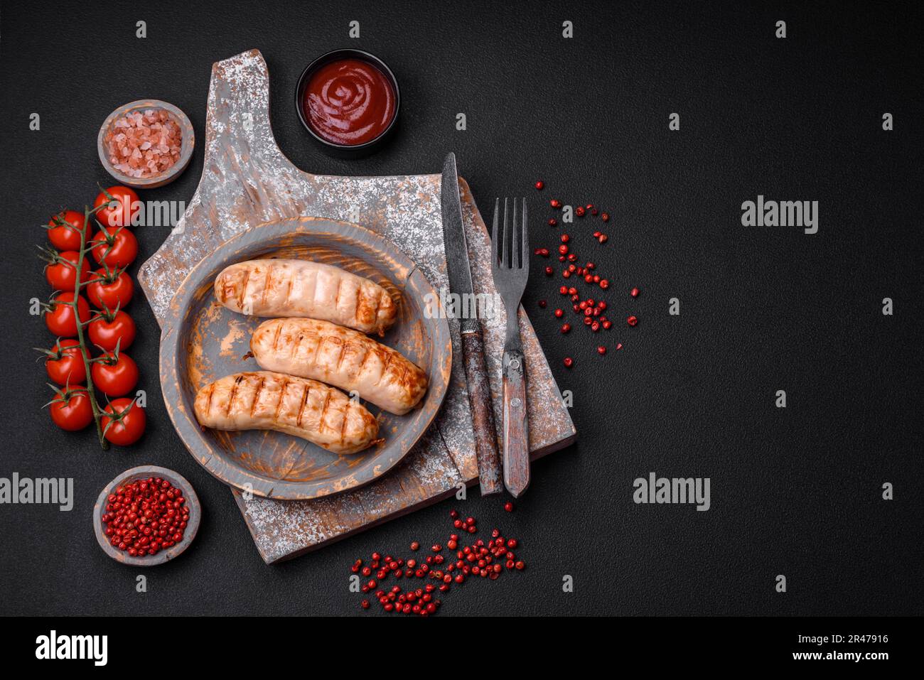 Delicious grilled sausages from chicken or pork meat with salt, spices ...