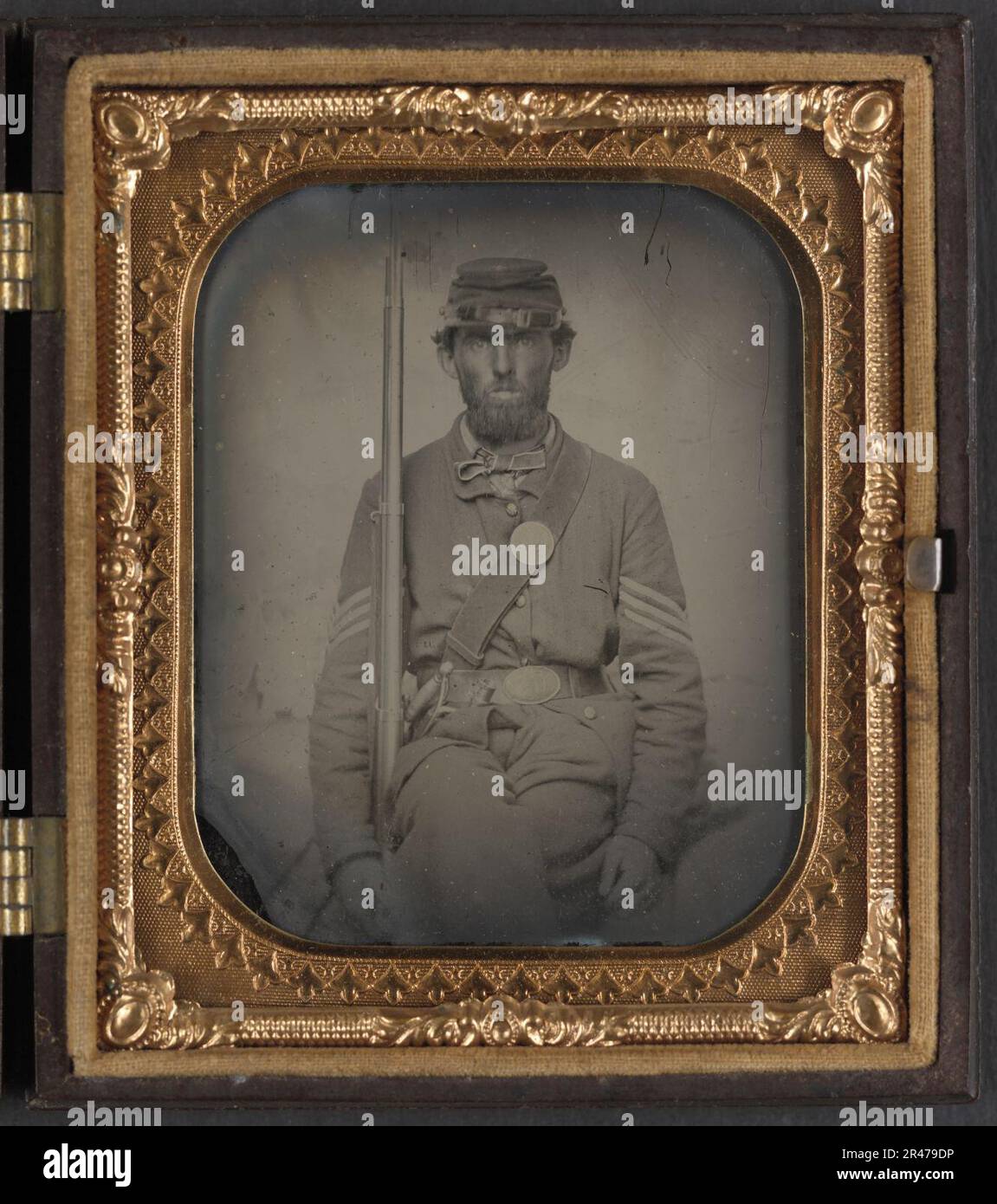 Unidentified soldier in Union sergeant's uniform with musket and sword ...