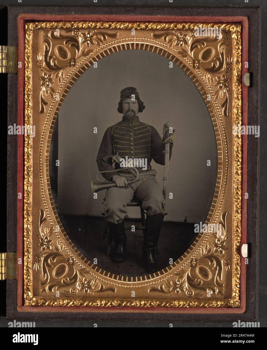 Unidentified soldier in Union uniform with bugle, sword, and revolver ...