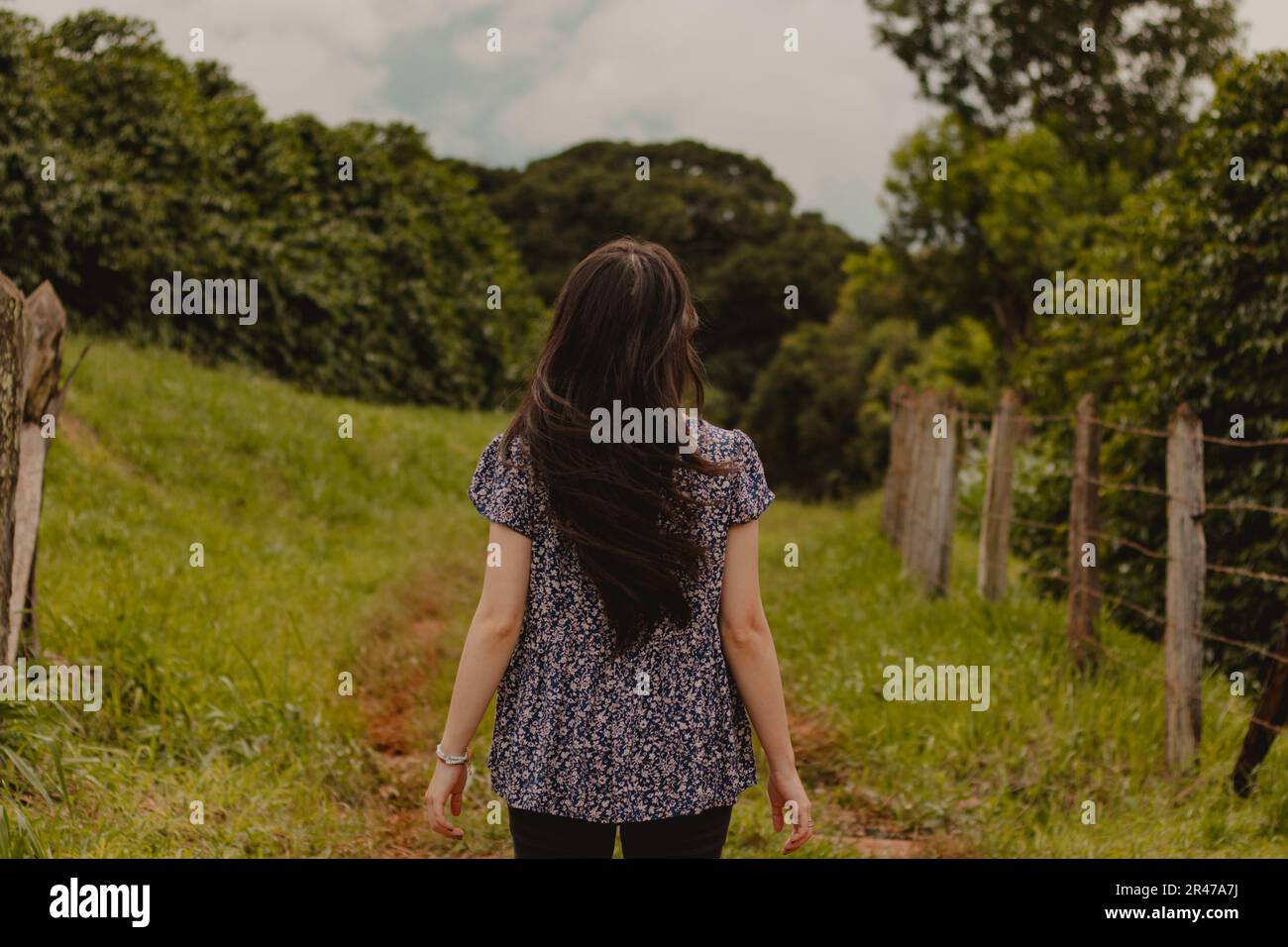 young woman with long black hair backwards Stock Photo - Alamy
