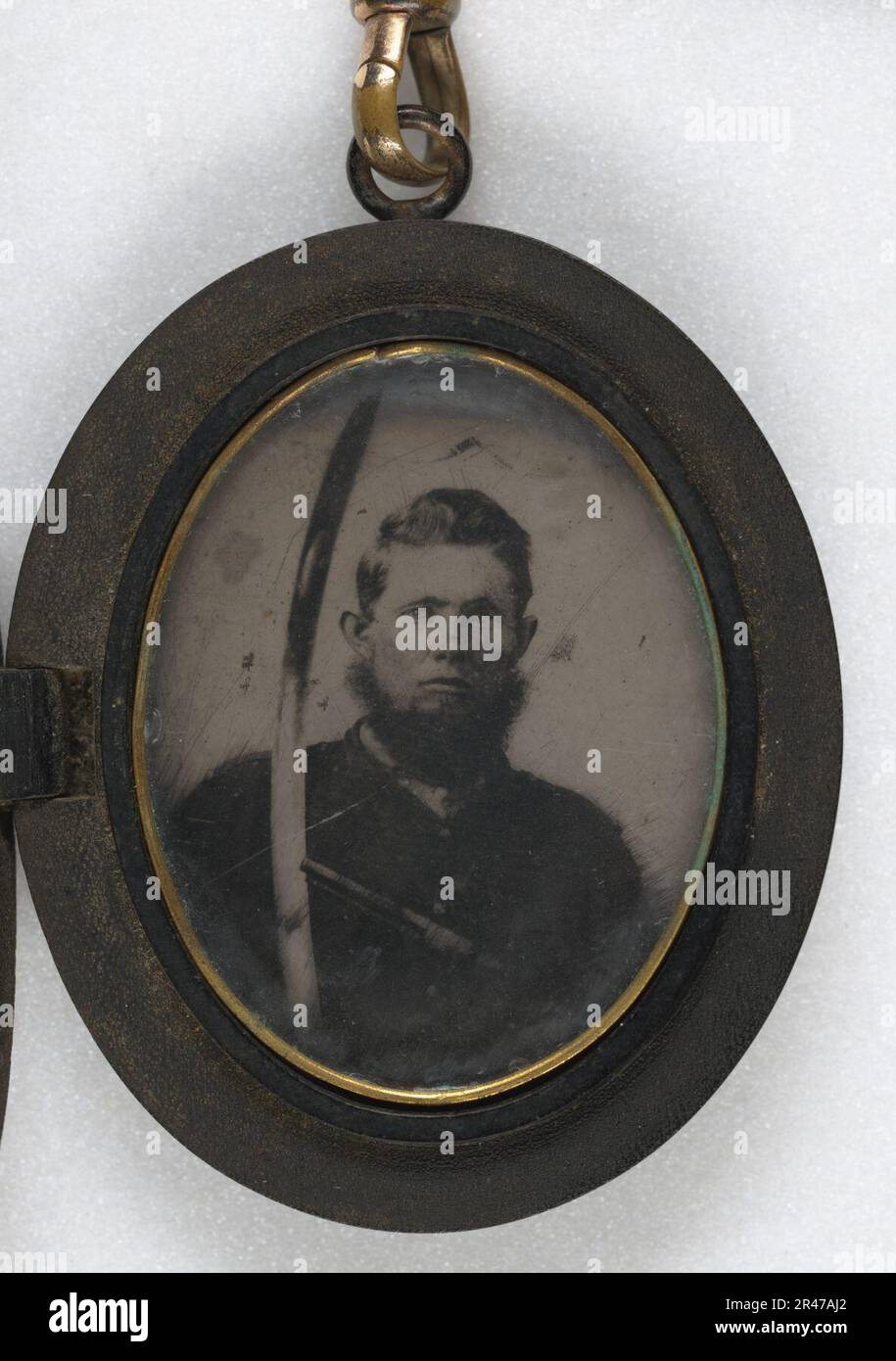 Unidentified soldier in Union uniform with saber and revolver in locket ...