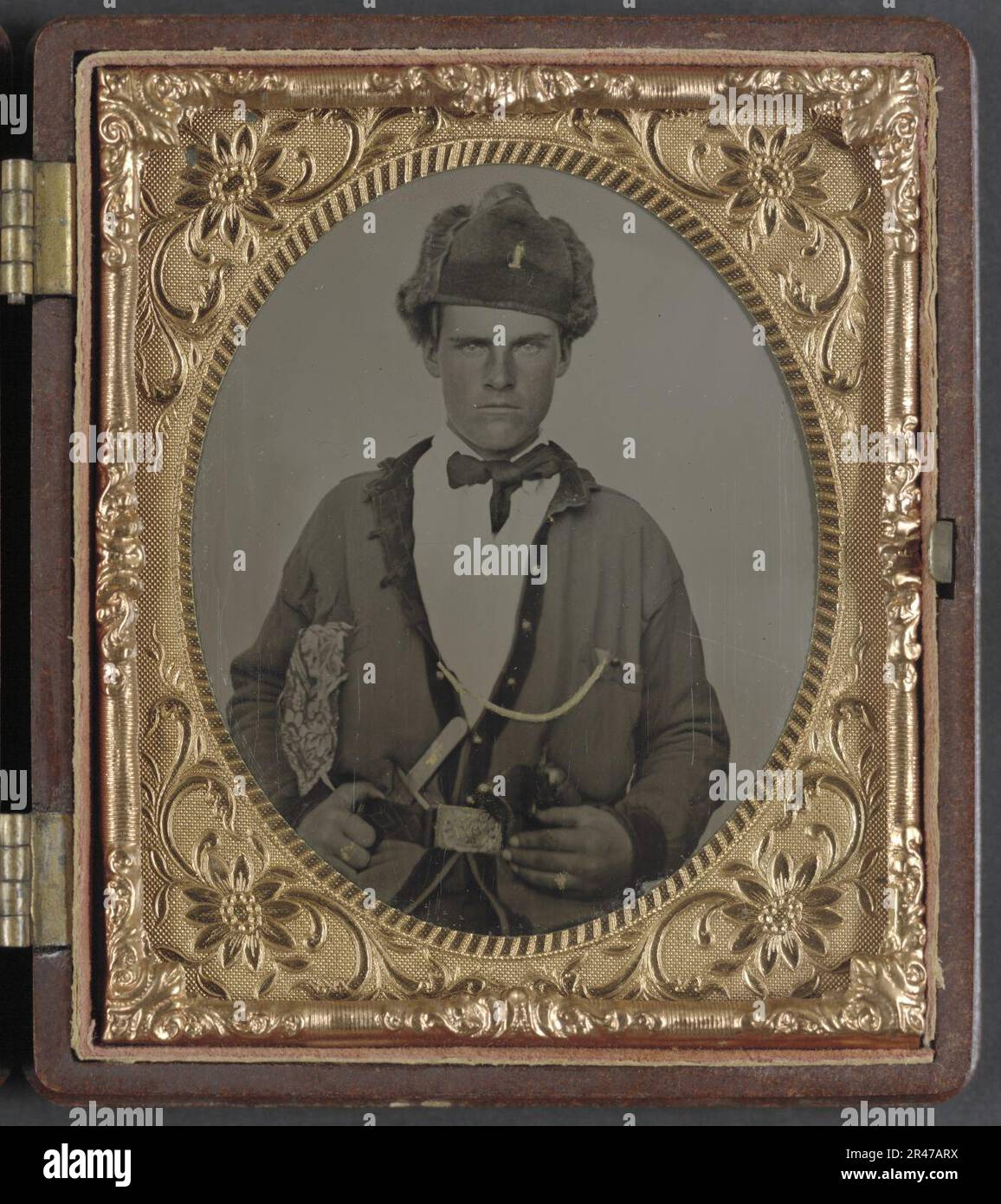 Unidentified soldier in Union uniform, U.S. cavalry belt, and fur hat ...