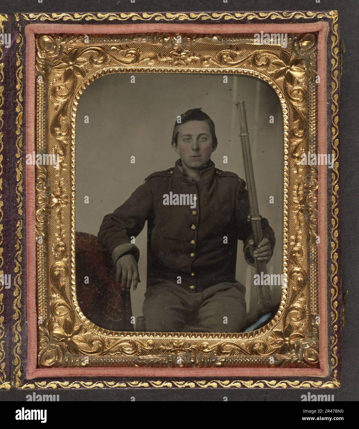 Unidentified young soldier in Union uniform holding Colt revolving ...