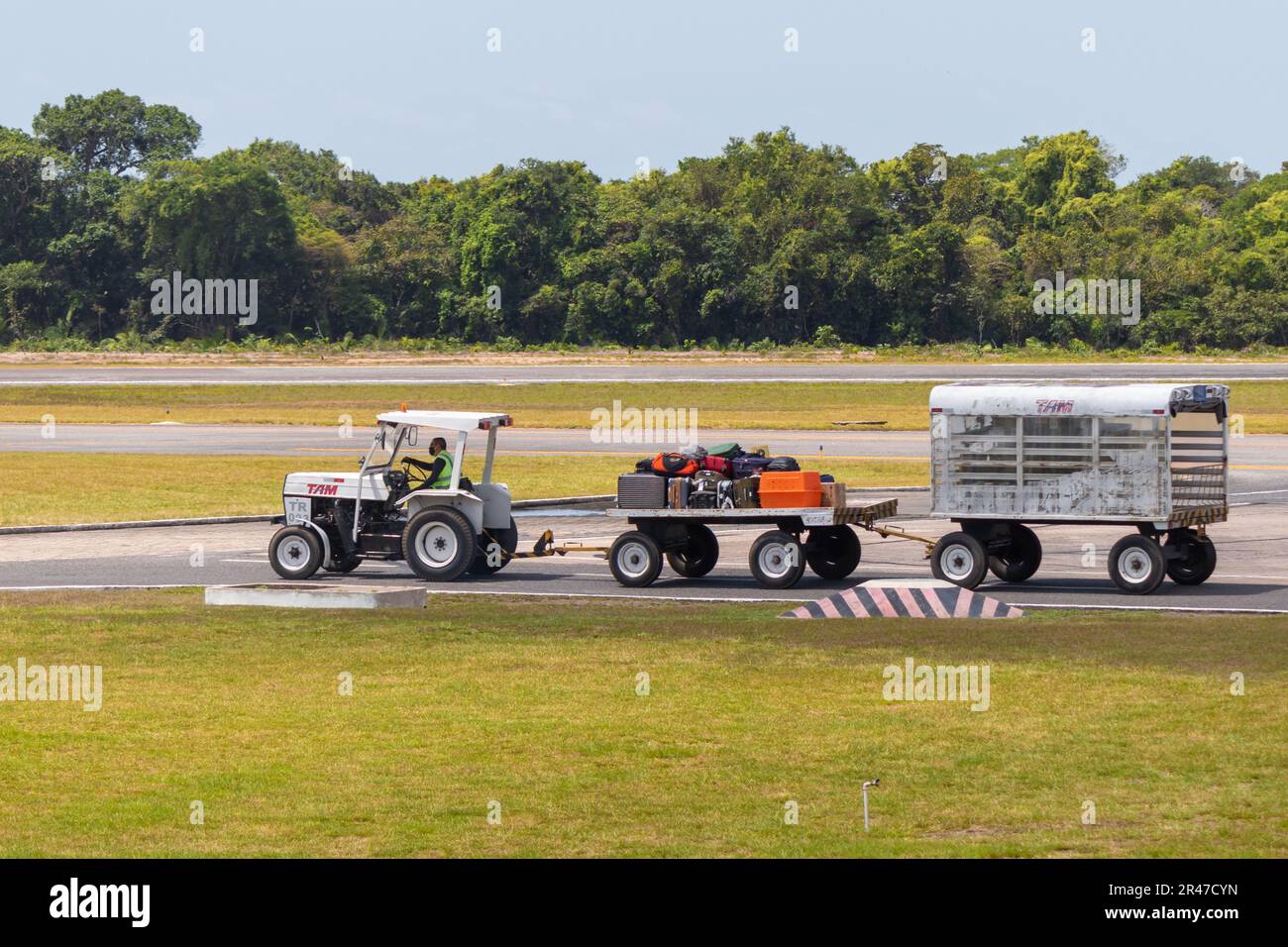 TAM (LATAM) tractor, responsible for luggage transport at Santarem ...