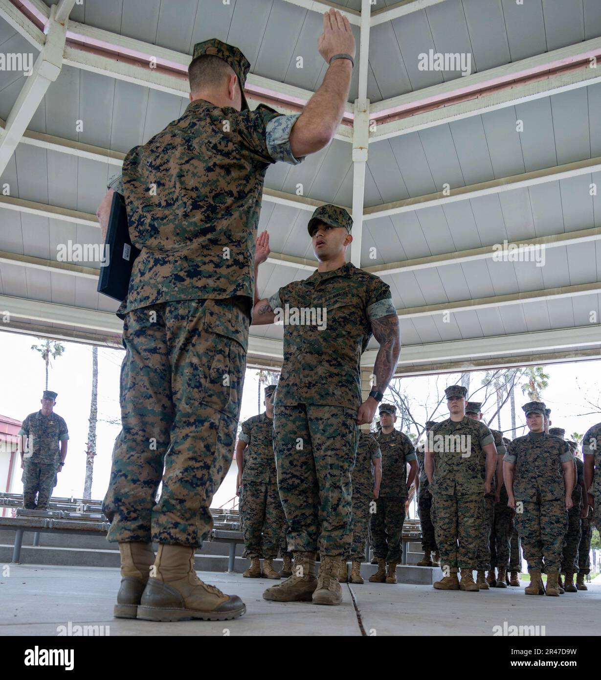 U.S. Marine Corps Staff Sgt. Arturo Mares, center, a staff secretary ...