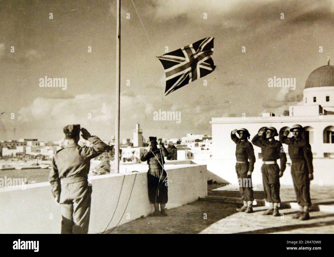 Union Jack being hoisted on Italian flagpole in Benghazi after the city ...