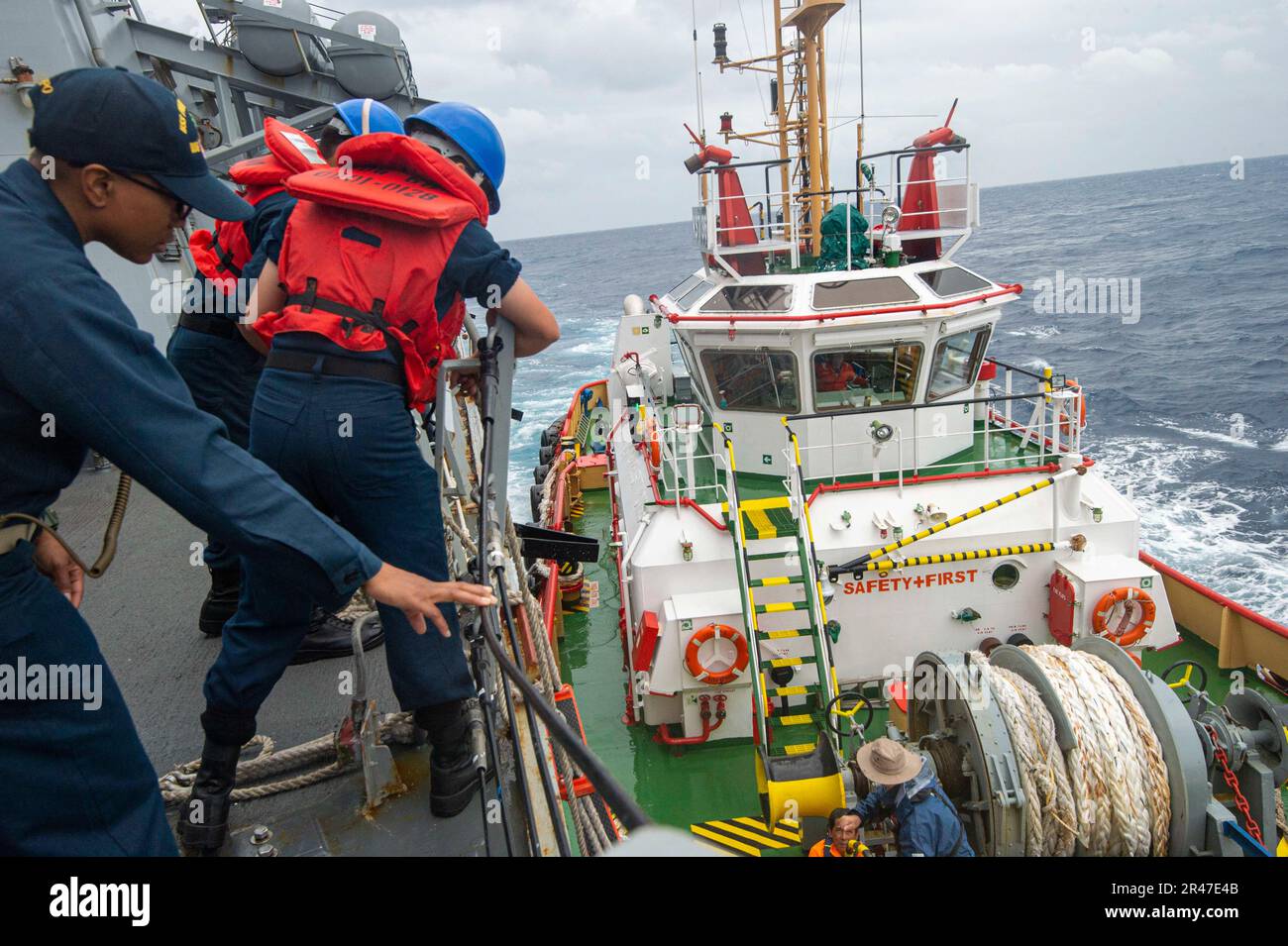 230211-N-NH267-1004 DIEGO GARCIA (Feb. 11, 2023) U.S. Navy Sailors man ...