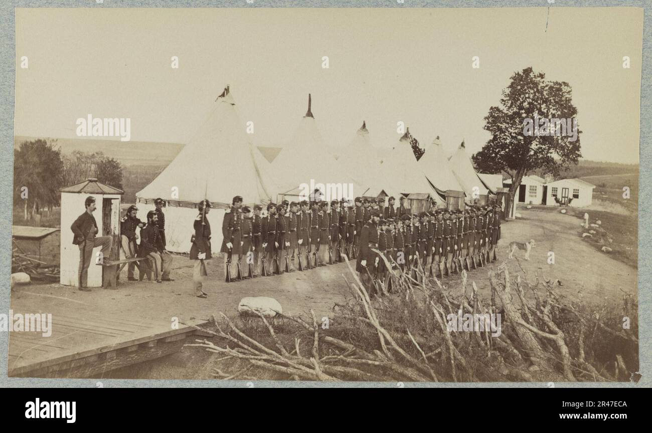 Union soldiers lined up in two rows in front of tents Stock Photo - Alamy