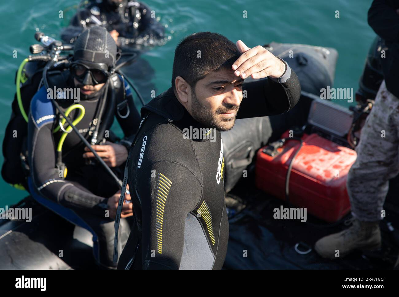 Kuwaiti Soldier prepares to inspect a vessel with U.S. Army Soldiers of ...
