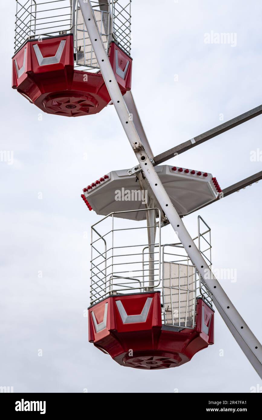 A pair of giant red and white paddle wheel cabins suspended from a ...