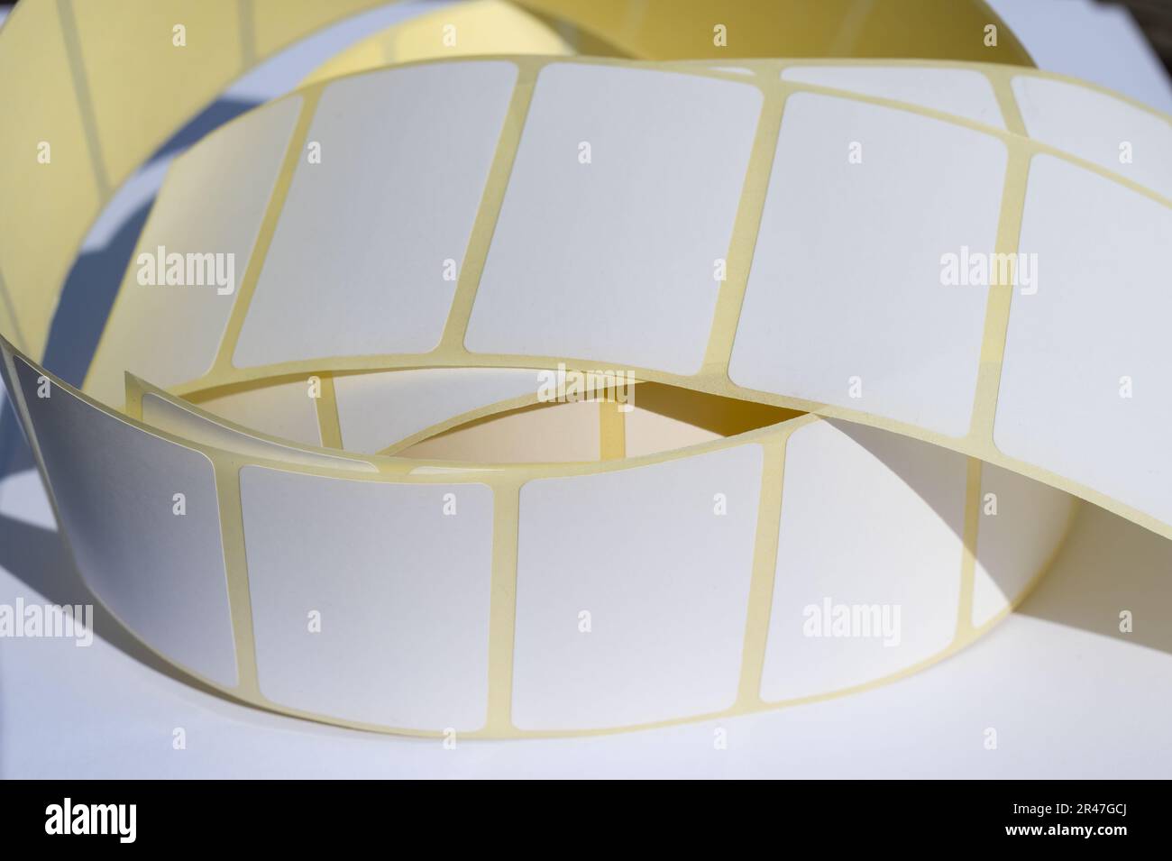 Rolls of white labels isolated. Labels for direct thermal or thermal ...