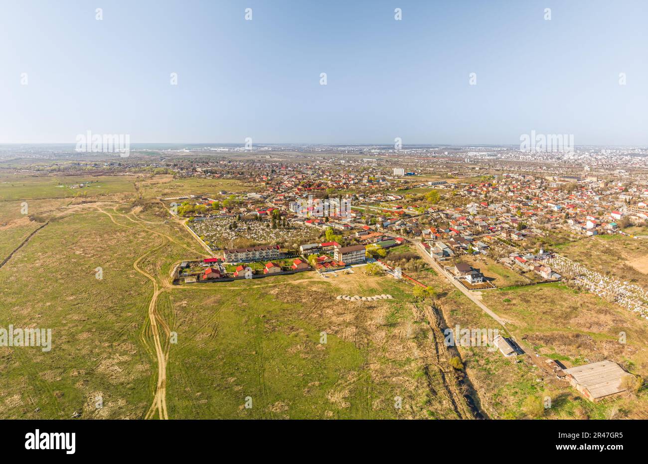 Aerial view of a remote rural village, featuring various buildings in a ...