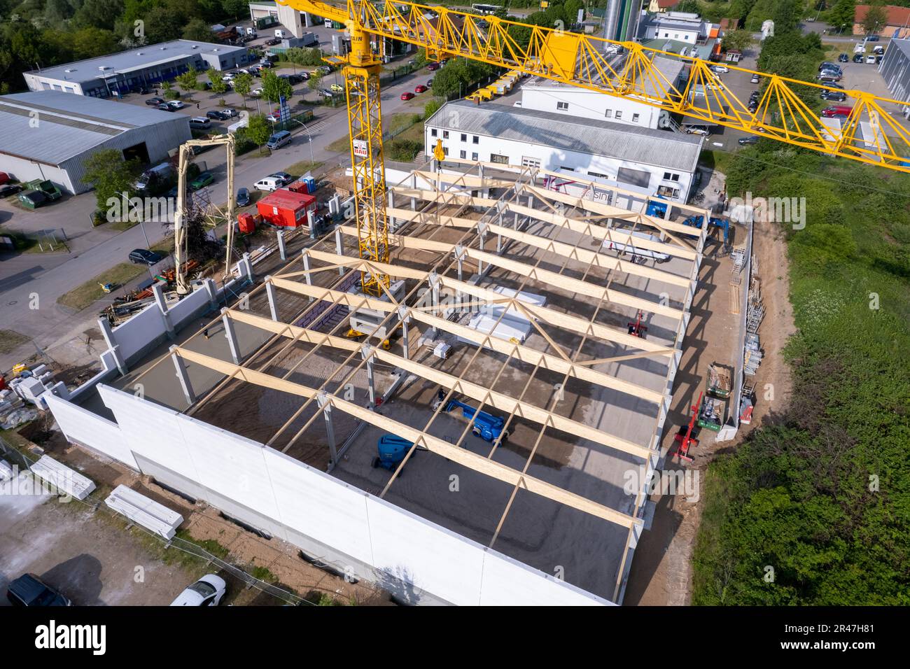 A drone shot of a construction site where a factory building is being ...