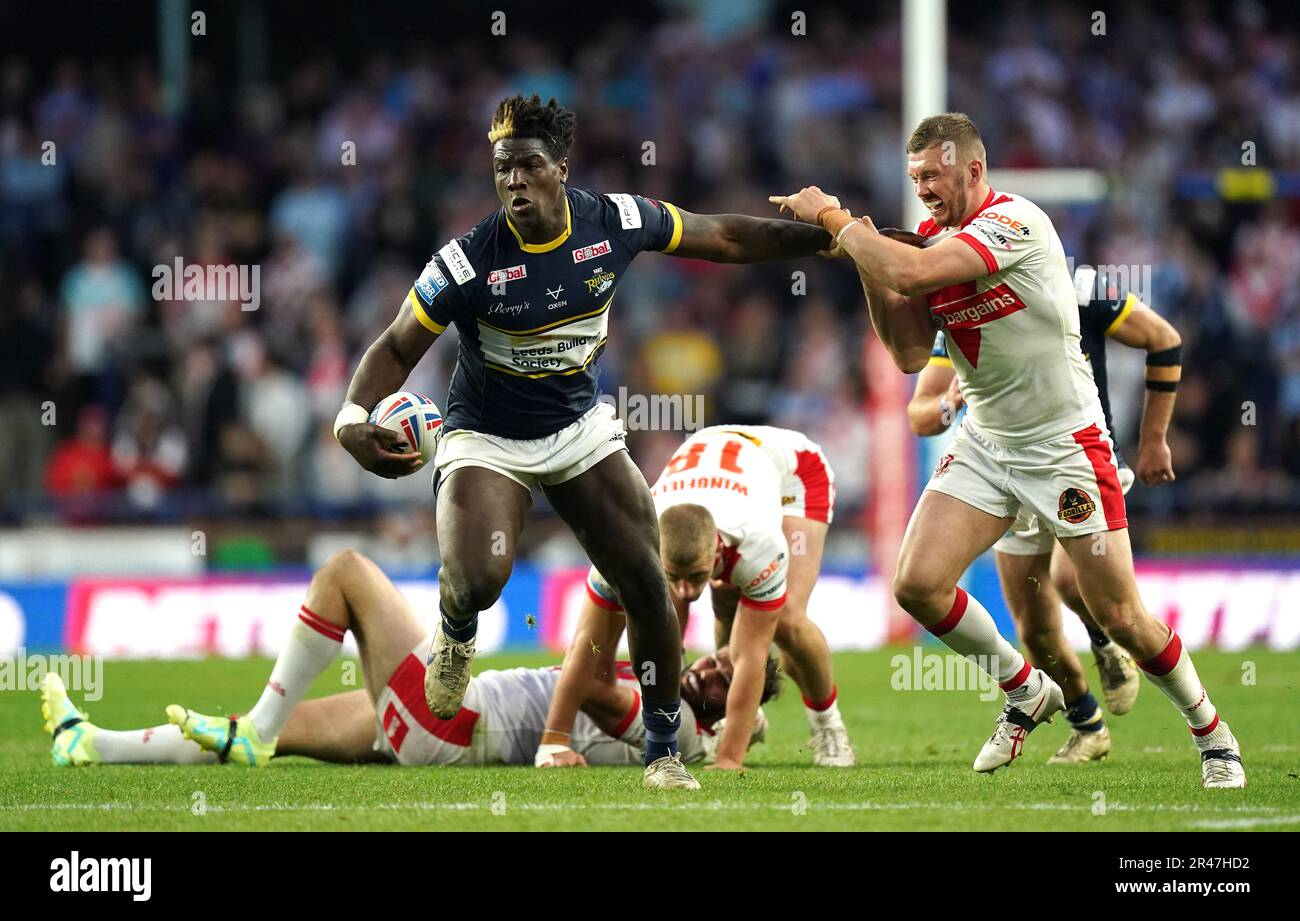Leeds Rhinos' Justin Sangare breaks free from St Helens' Joe Batchelor ...