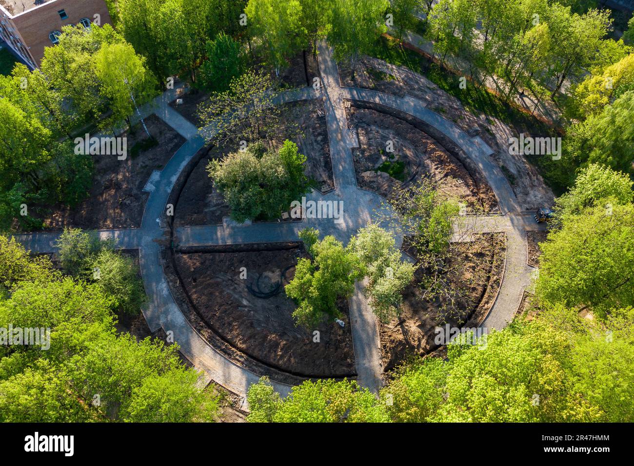 Reconstruction of a city square of a round shape with paths surrounded ...