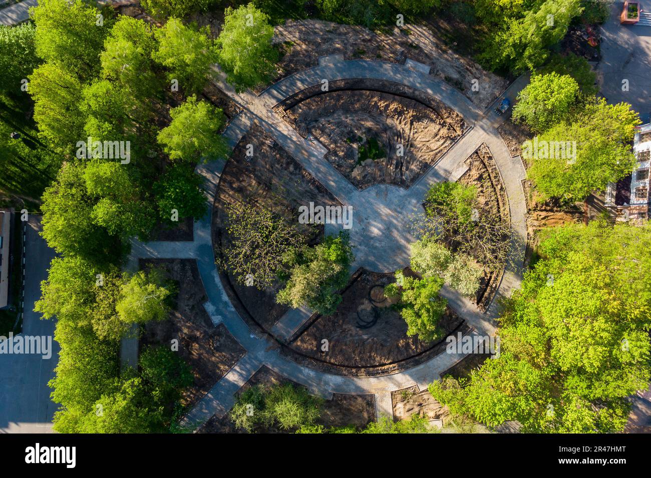 Reconstruction of a city square of a round shape with paths surrounded ...