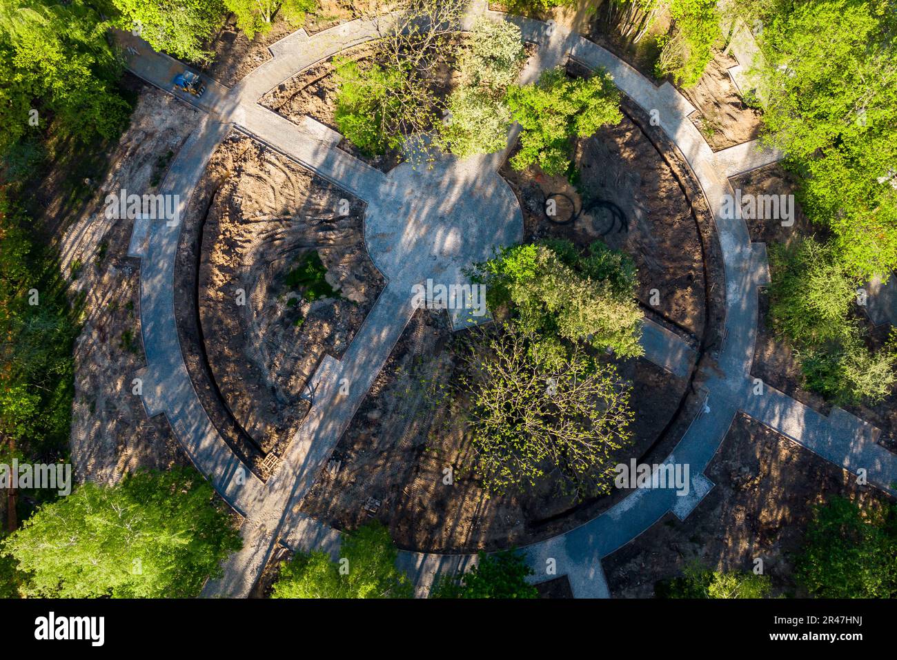 Reconstruction of a city square of a round shape with paths surrounded ...