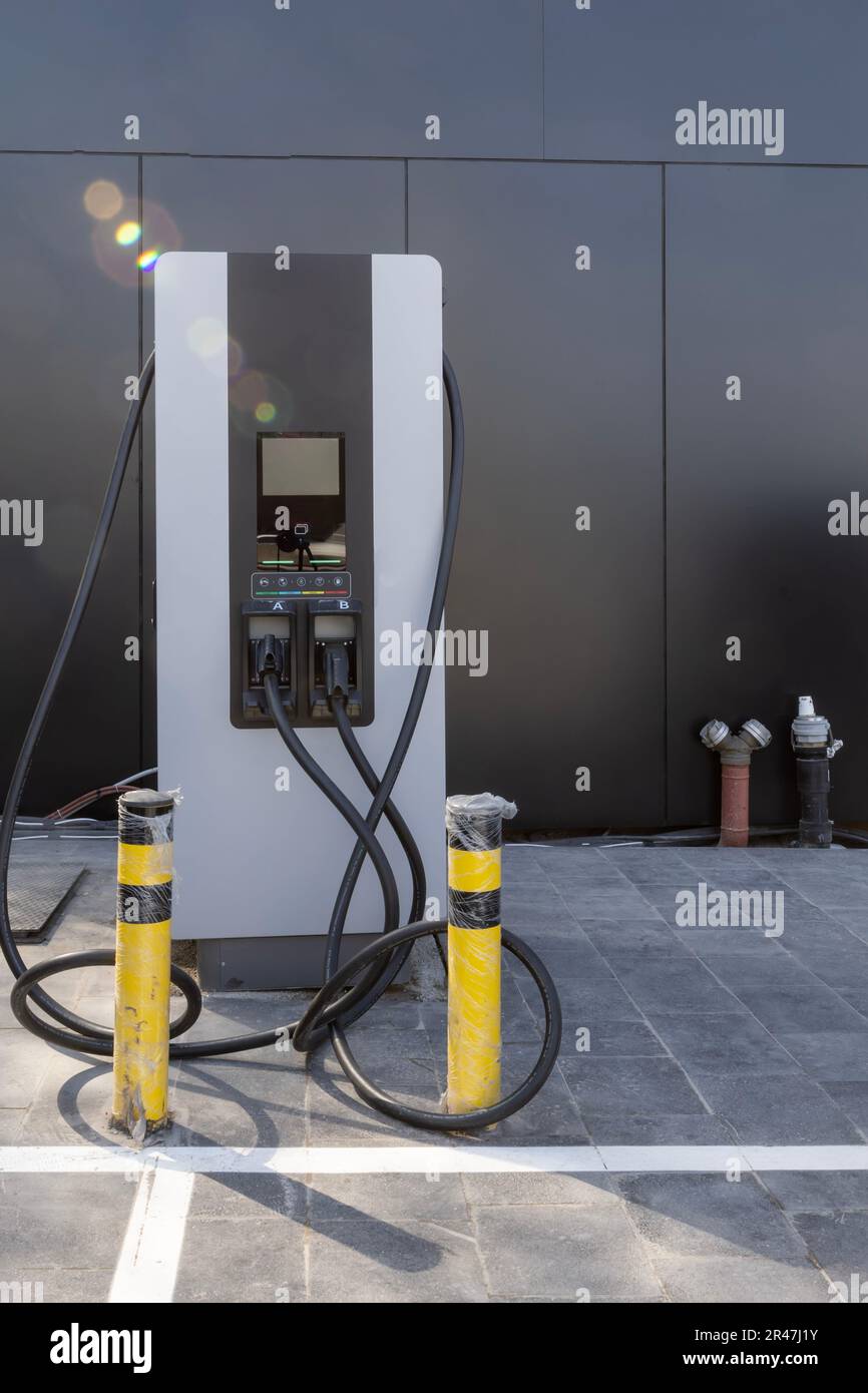 EV charging an electric car. Power supply for electric car charging ...