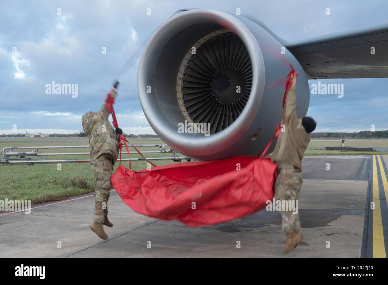 U.S. Air Force Senior Airman Eric Ridout, left, 100th Aircraft ...