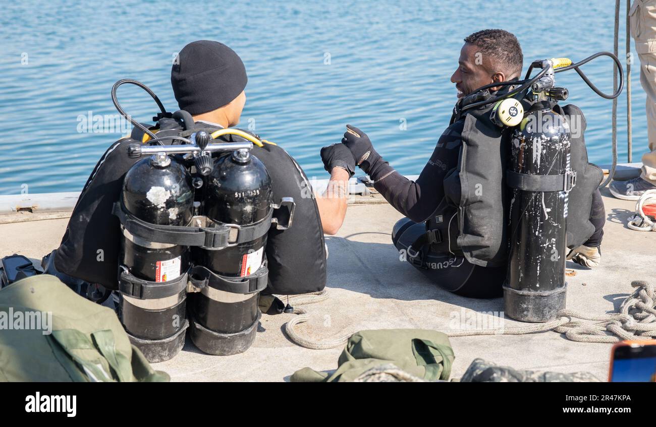 U.S. Army Soldier with the 511th Engineer Dive Detachment shares a fist ...