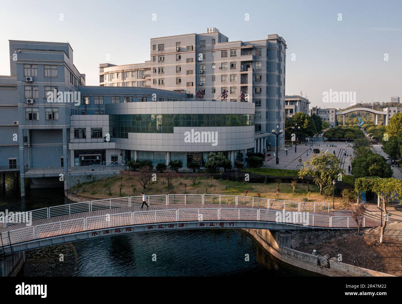 An aerial view of a cityscape with a large bridge spanning the river ...