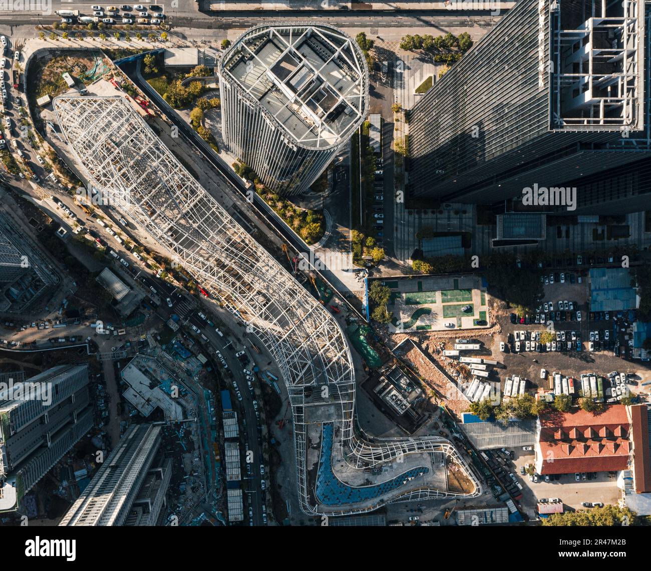 Aerial view of city skyline featuring a train track winding between two ...