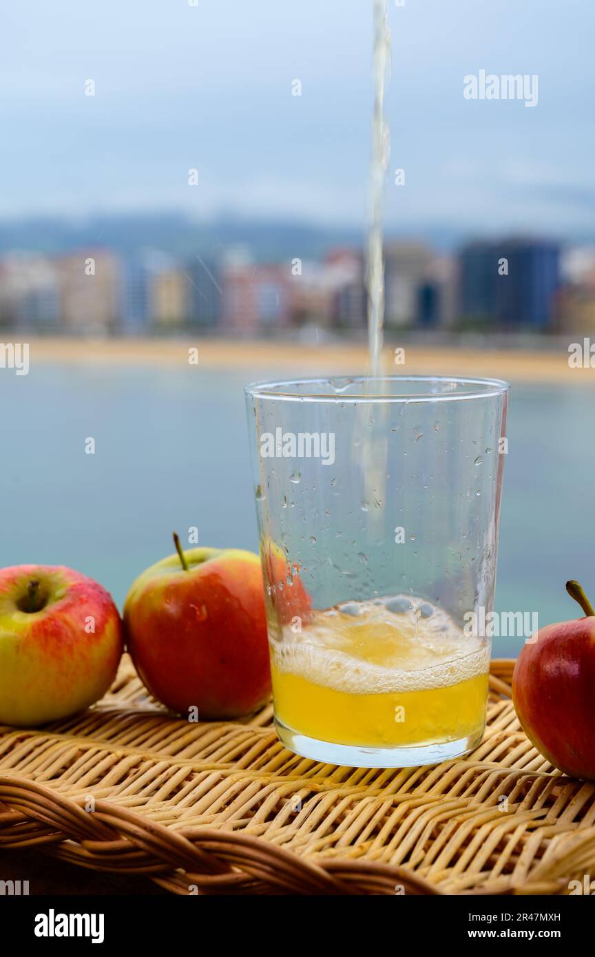 Traditional natural Asturian cider made from fermented apples in wooden ...
