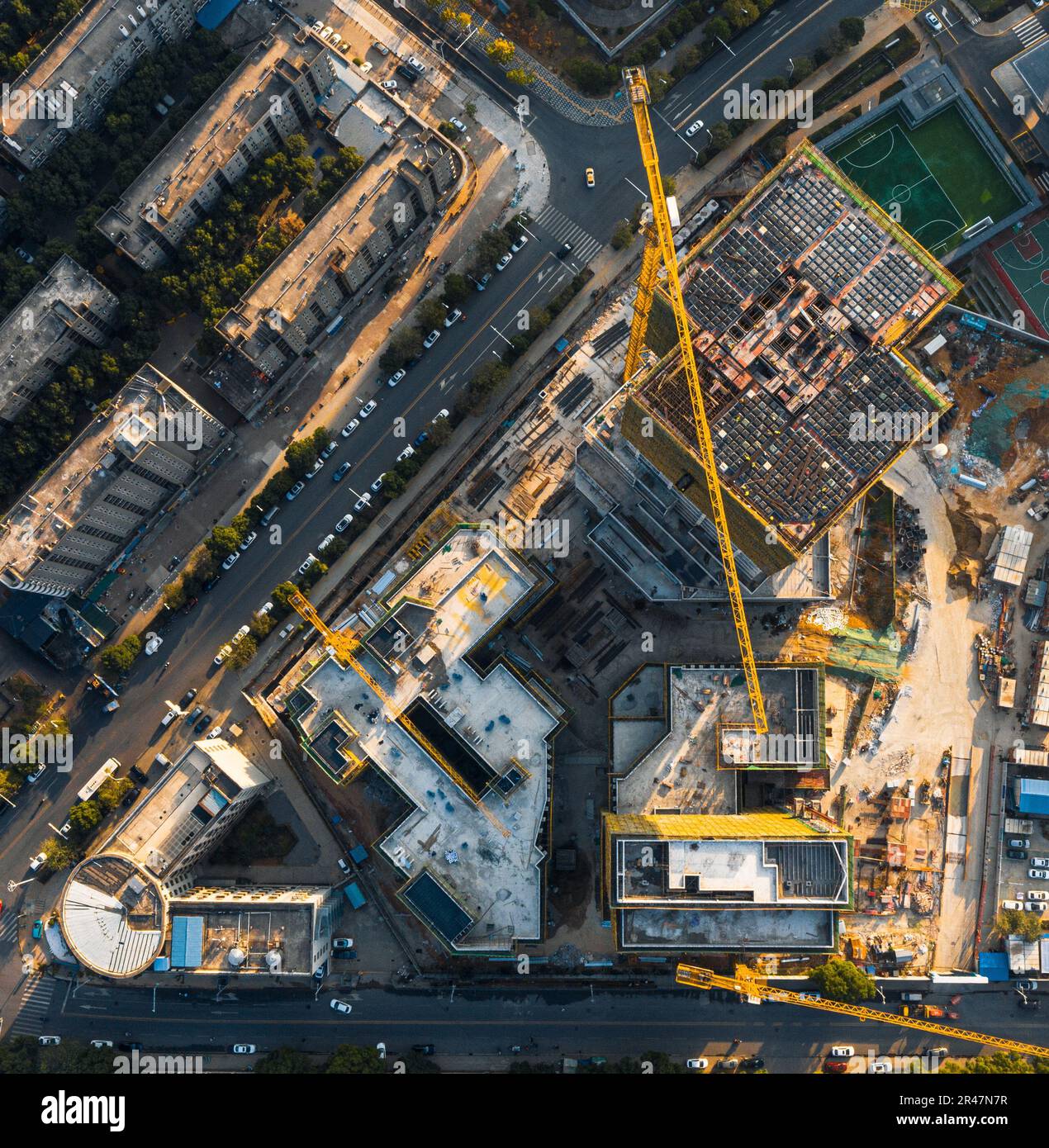 A view of a city street with asphalt pavement and construction barriers ...