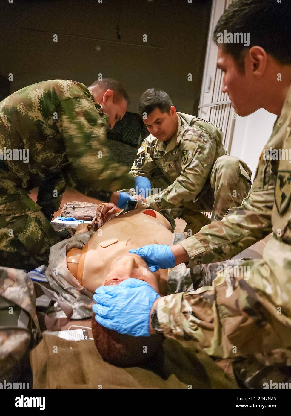 WHINSEC personnel tend to the injuries on the medical simulator manikin ...